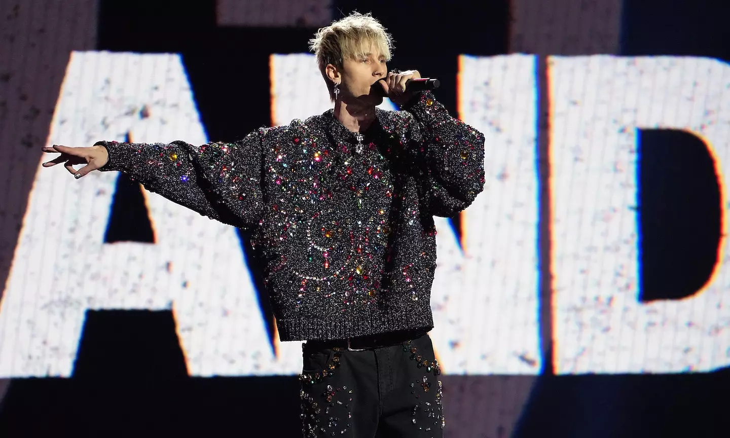 Machine Gun Kelly wäert e spielbaren Charakter am 'WWE 2K22' sinn